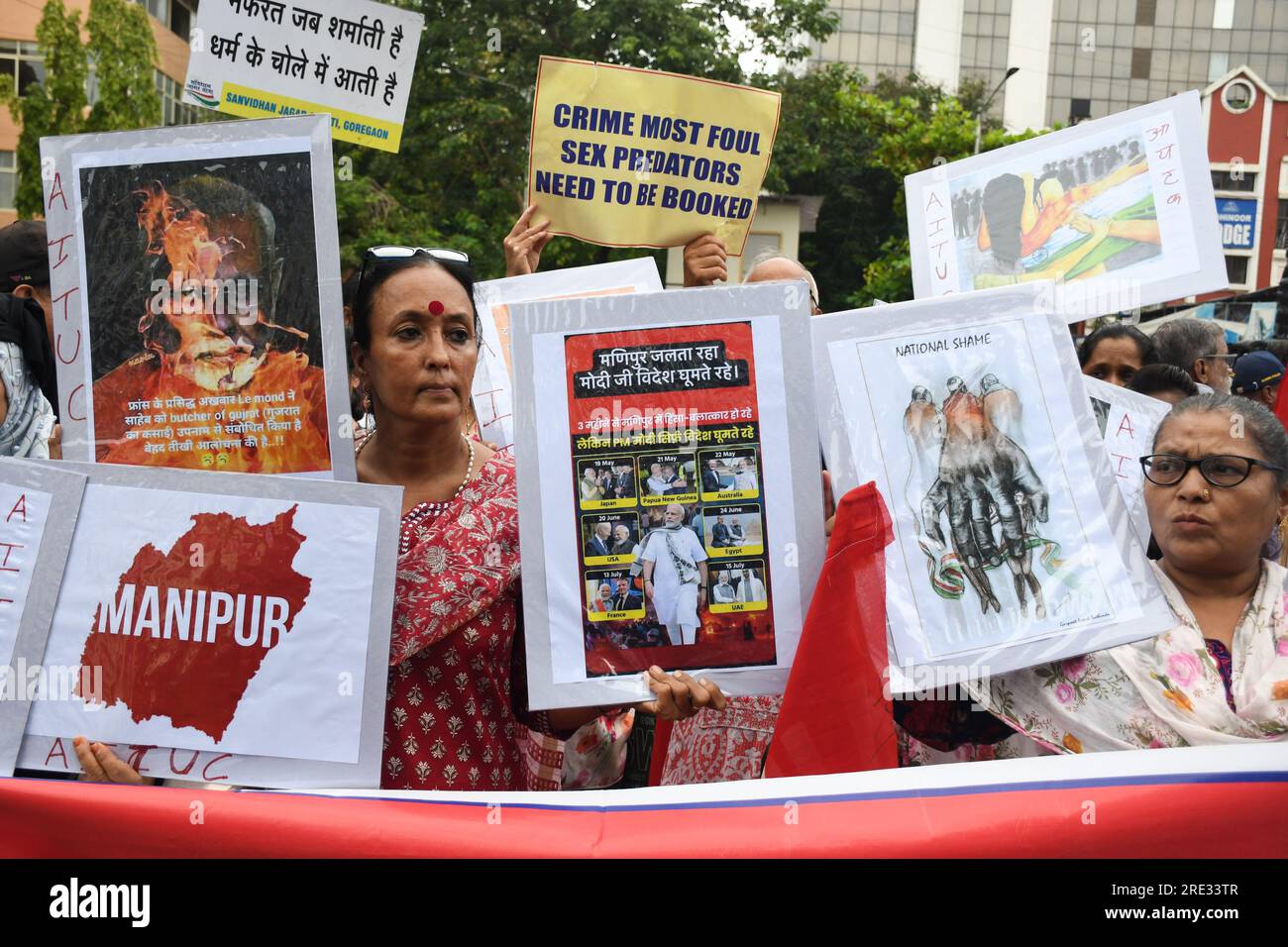 Mumbai, India. 24th July, 2023. Protesters hold placards expressing ...