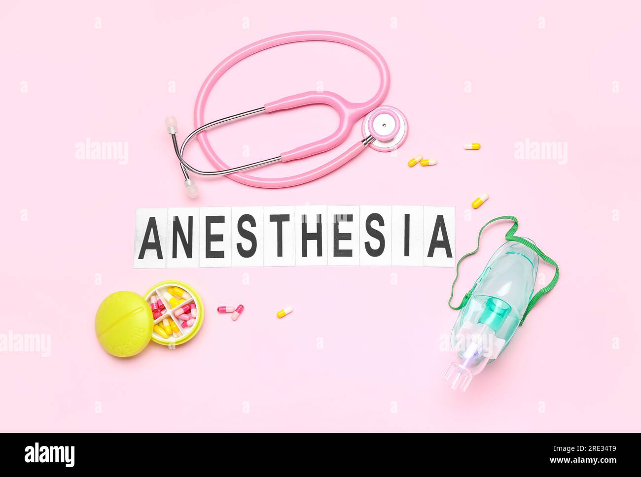 Word ANESTHESIA with stethoscope, pills and oxygen mask on pink ...