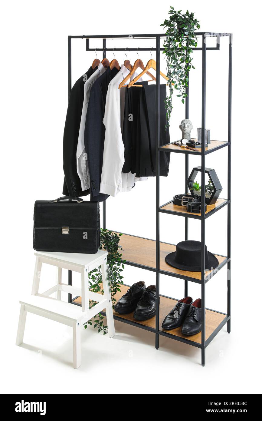 Shelving unit with clothes, shoes and accessories on white background ...