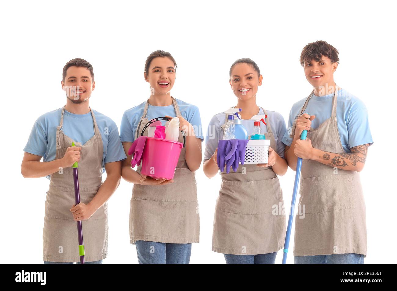 Young janitors with cleaning supplies on white background Stock Photo ...