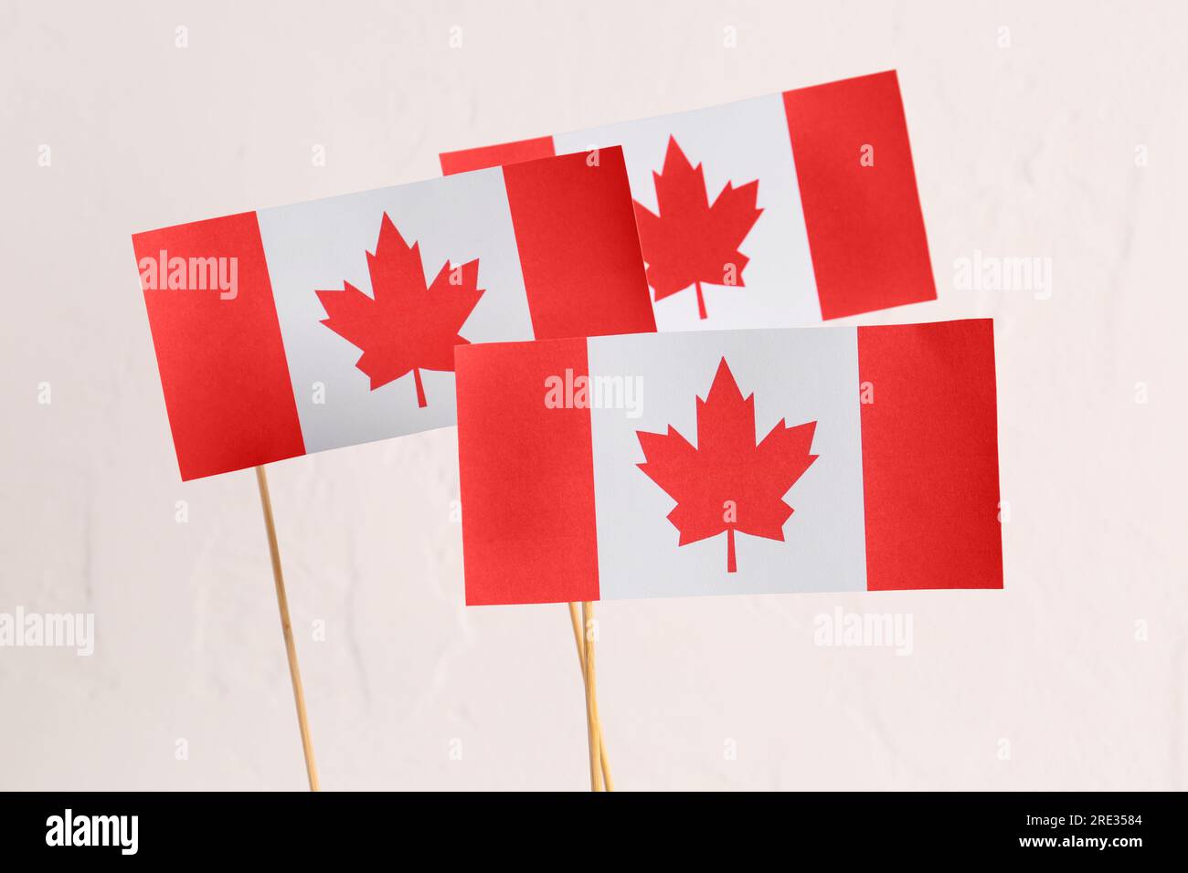 Paper flags of Canada on white background Stock Photo - Alamy