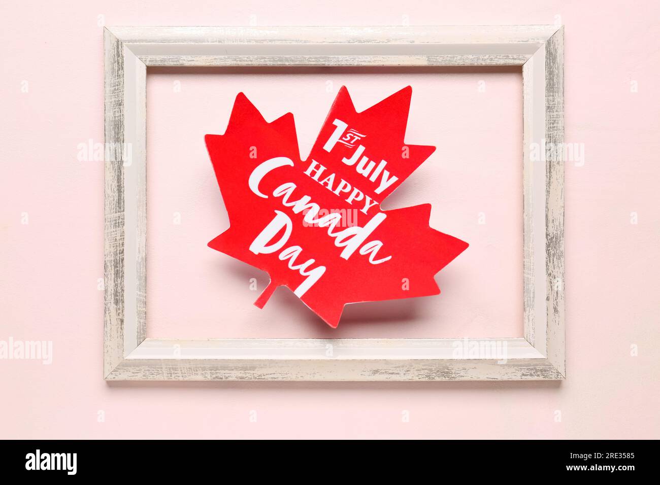 Maple leaf with text 1ST JULY HAPPY CANADA DAY and frame on white ...