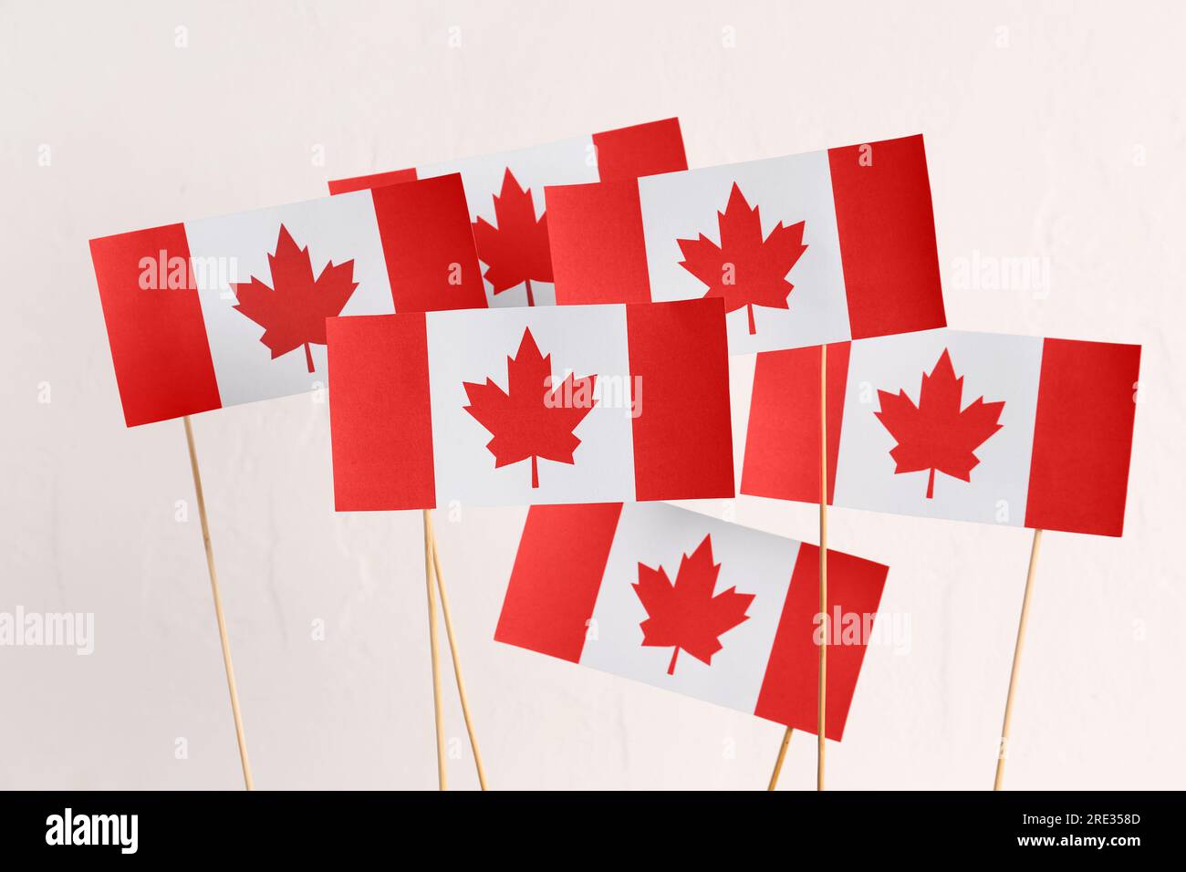 Paper flags of Canada on white background Stock Photo - Alamy