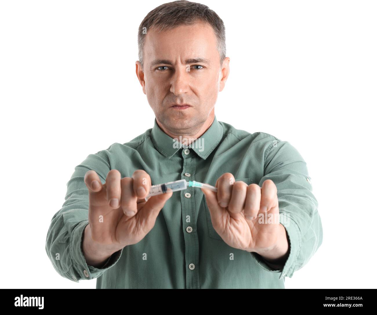 Mature drug addict breaking syringe on white background Stock Photo - Alamy