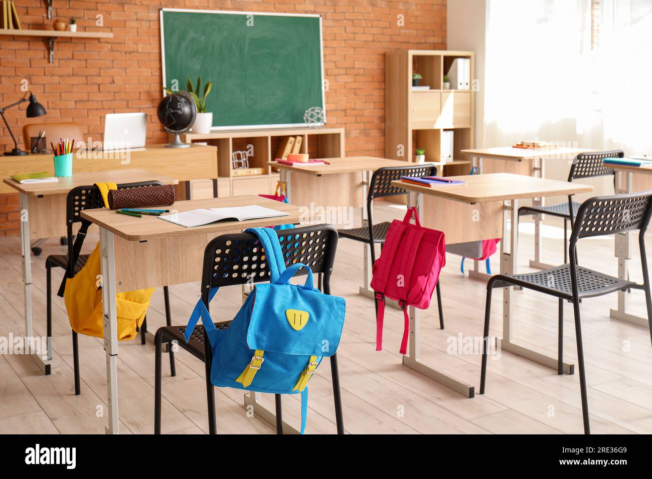 Children backpacks classroom table hi-res stock photography and images ...