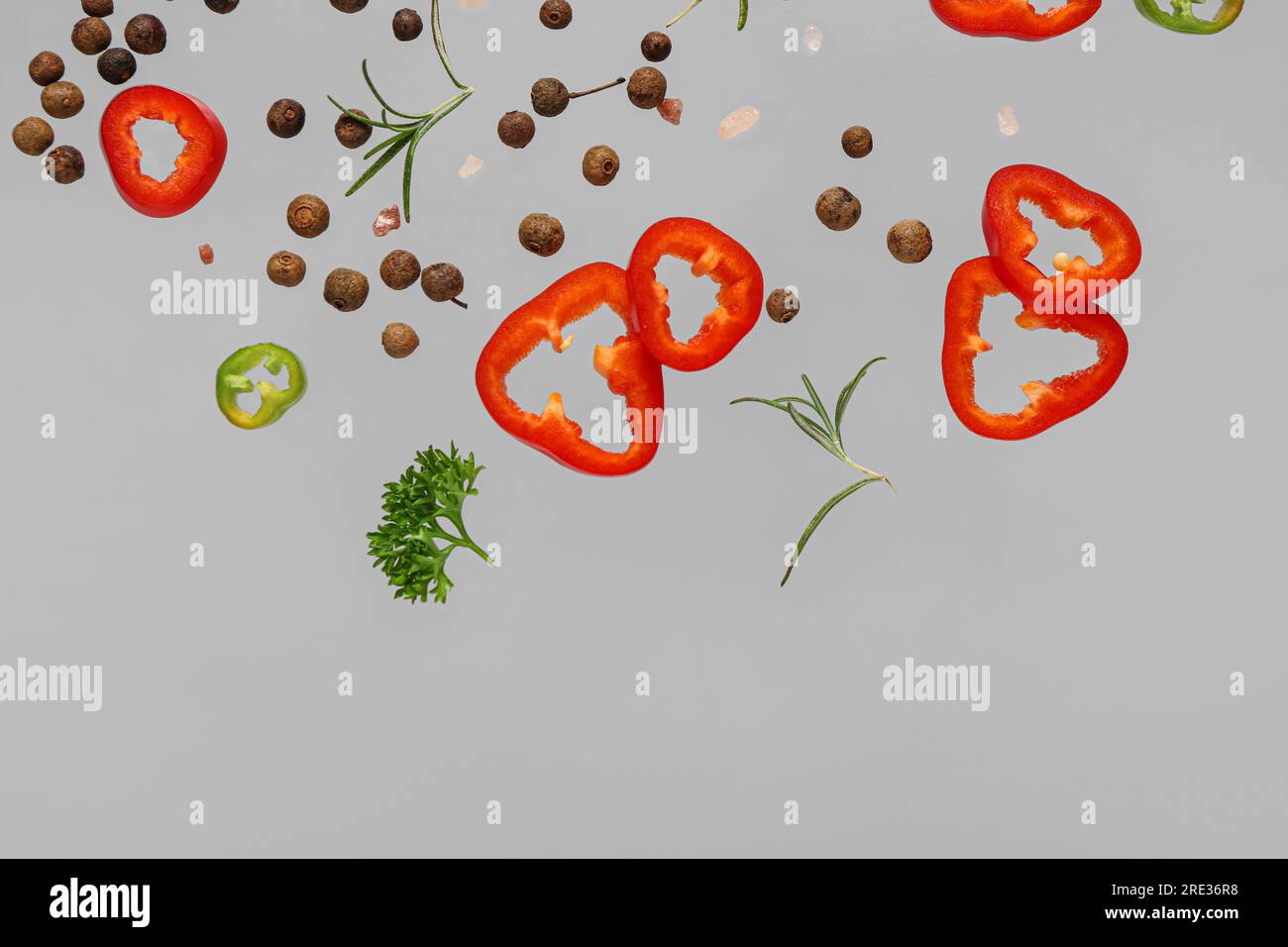 Flying spices on grey background Stock Photo - Alamy