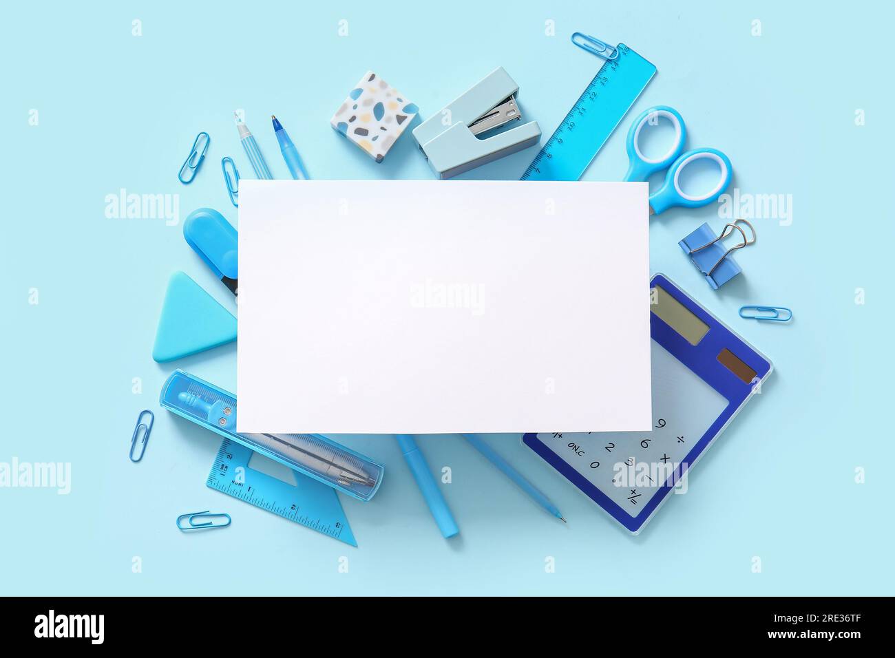 Composition with blank paper sheet and different school stationery on ...