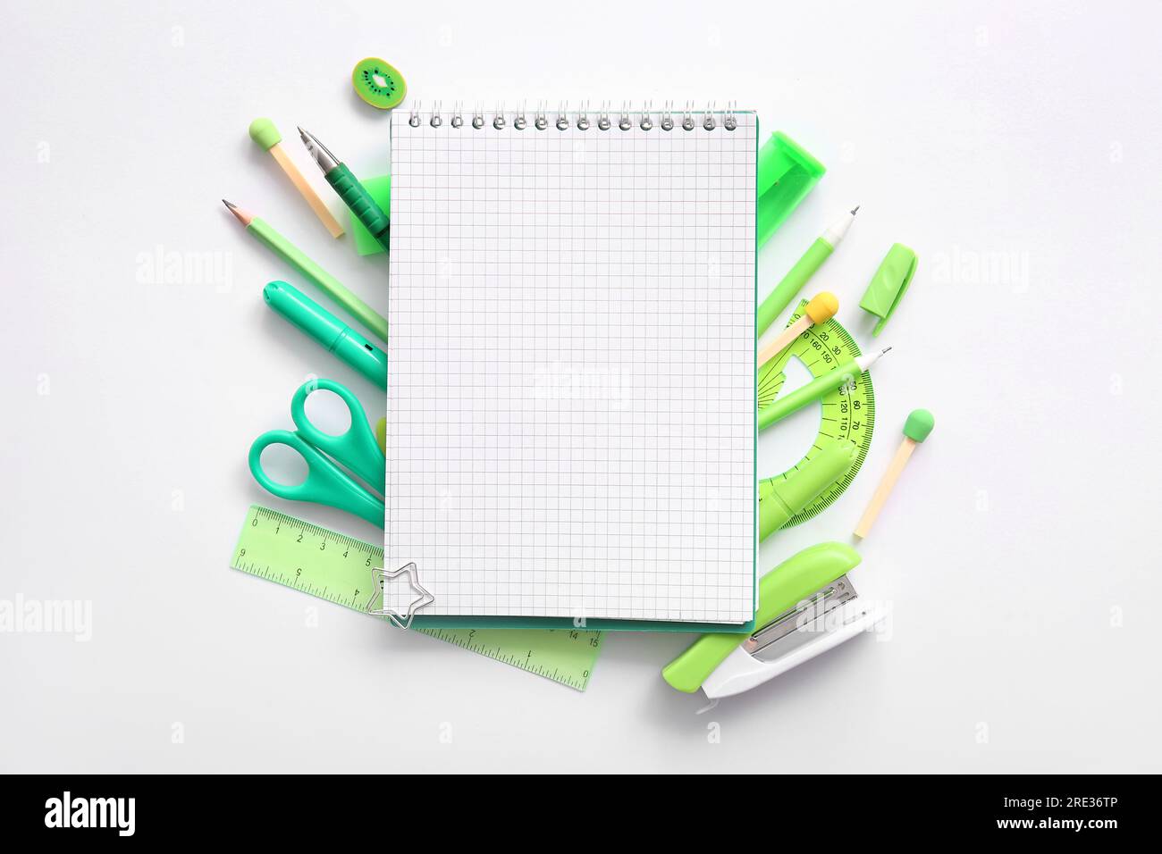 Composition with blank notebook and different school stationery on ...