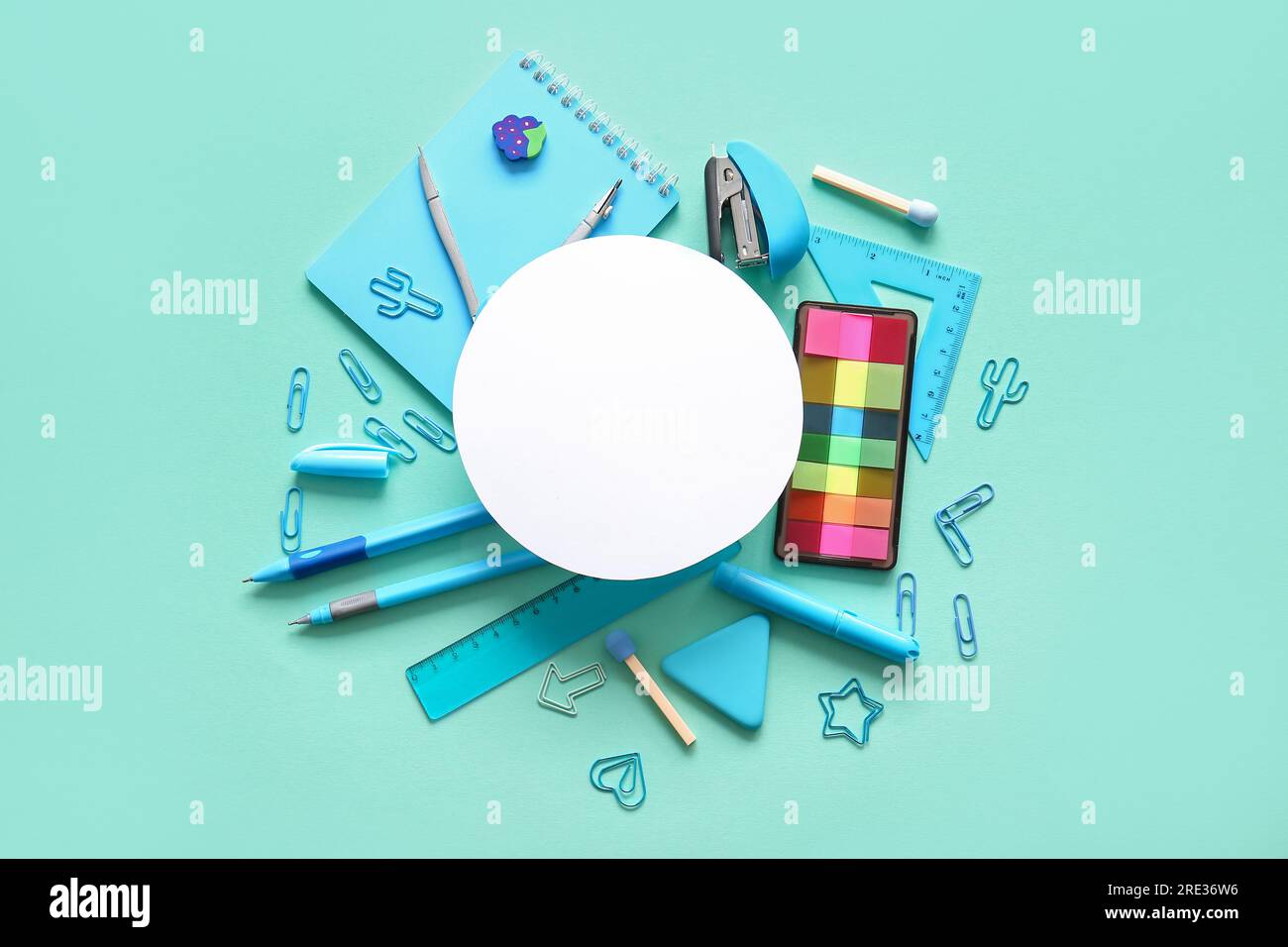 Composition with blank paper sheet and different school stationery on ...