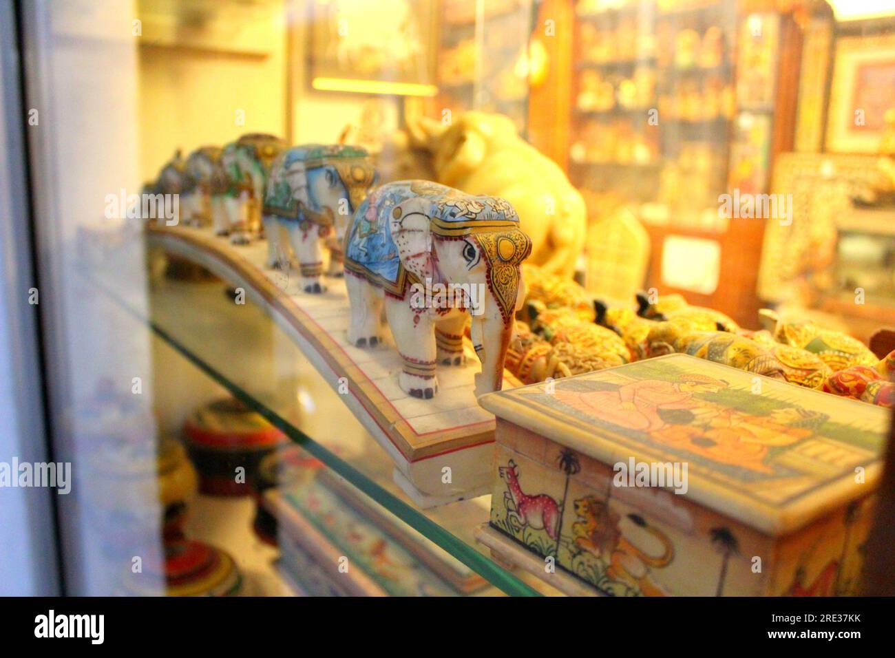 Painted elephants in marble in display for sale. White marble elephants ...