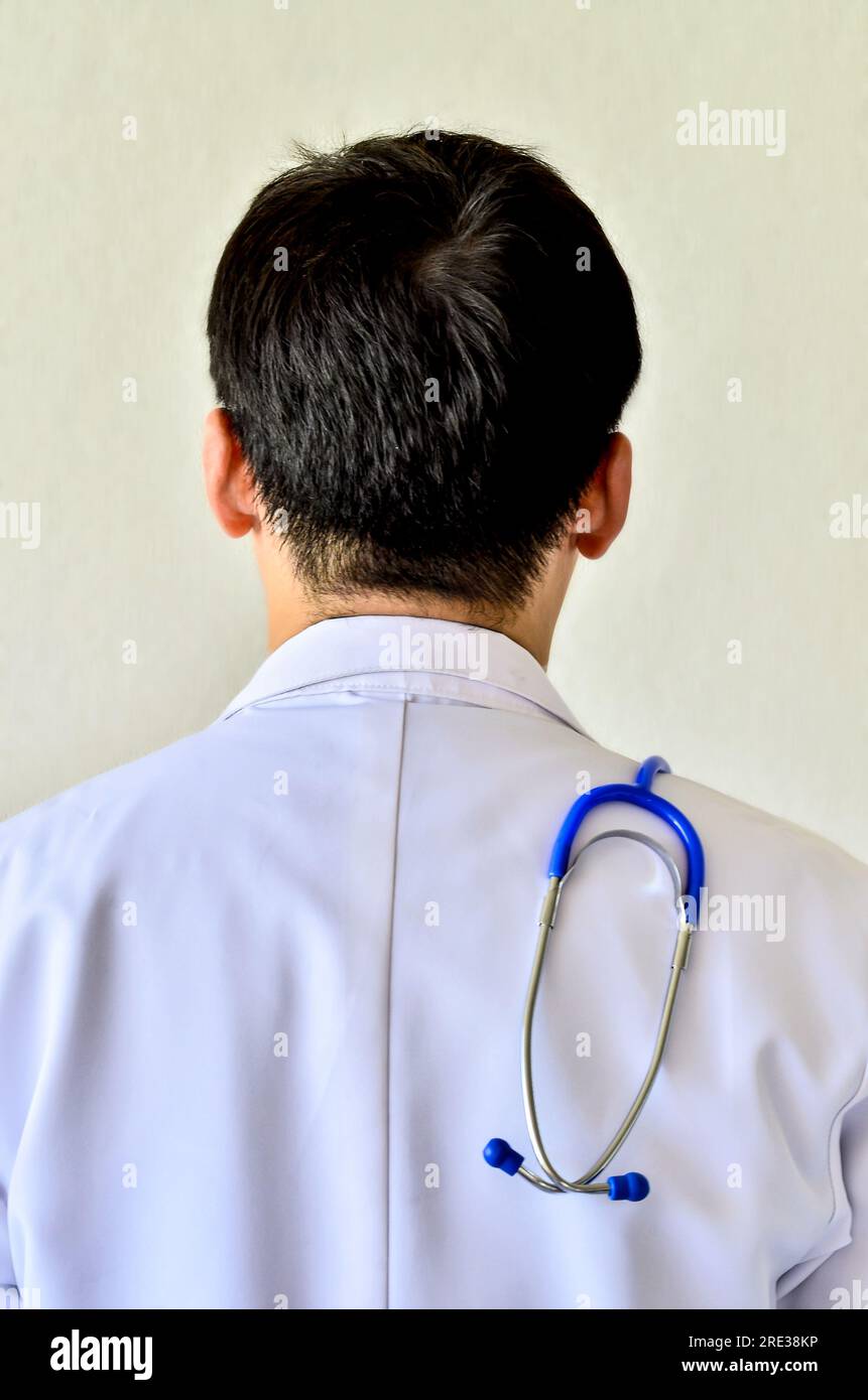 Back view of hard work male doctor Stock Photo - Alamy