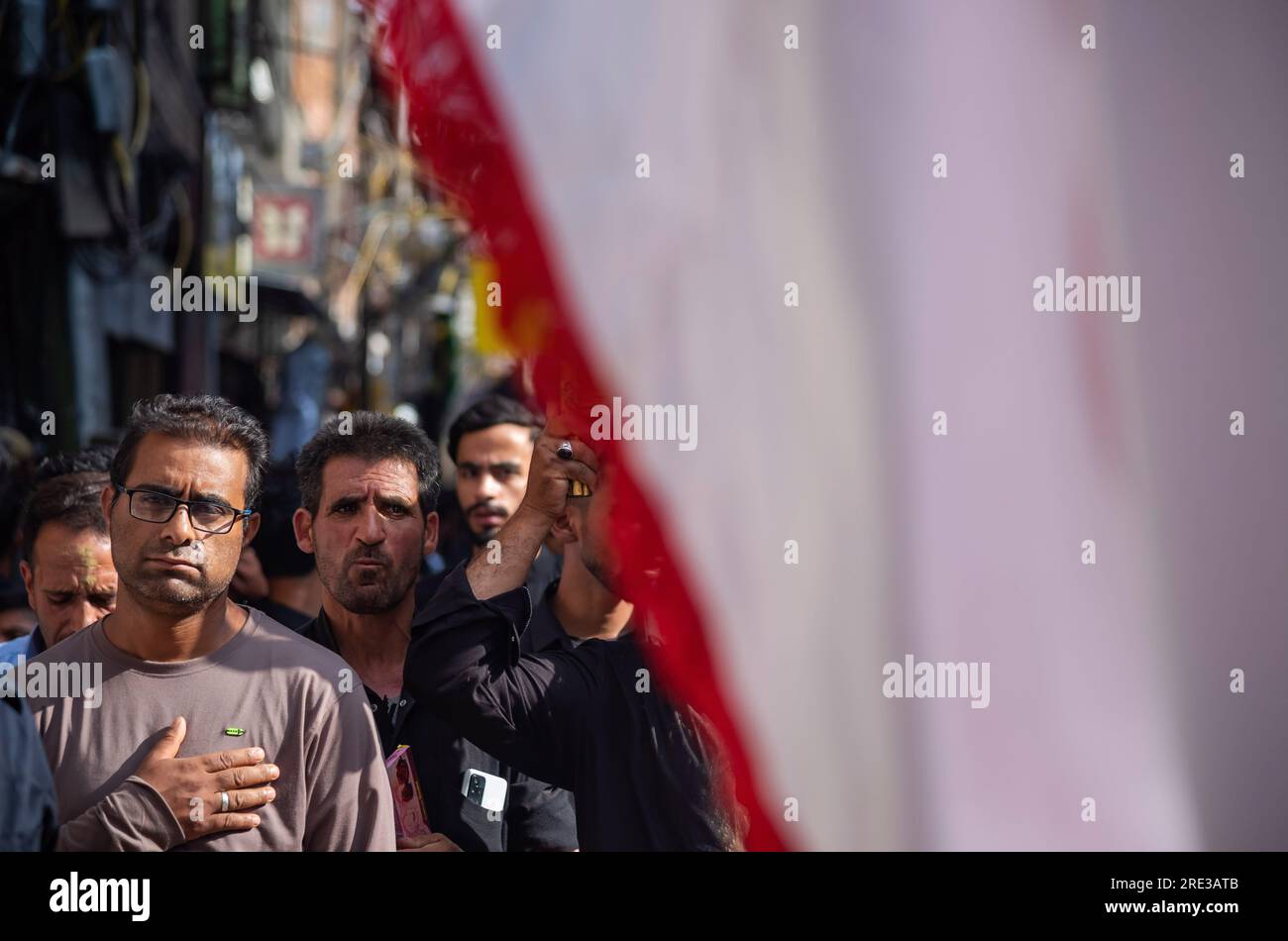 Srinagar, India. 24th July, 2023. Shia Muslims beat their chest as they ...