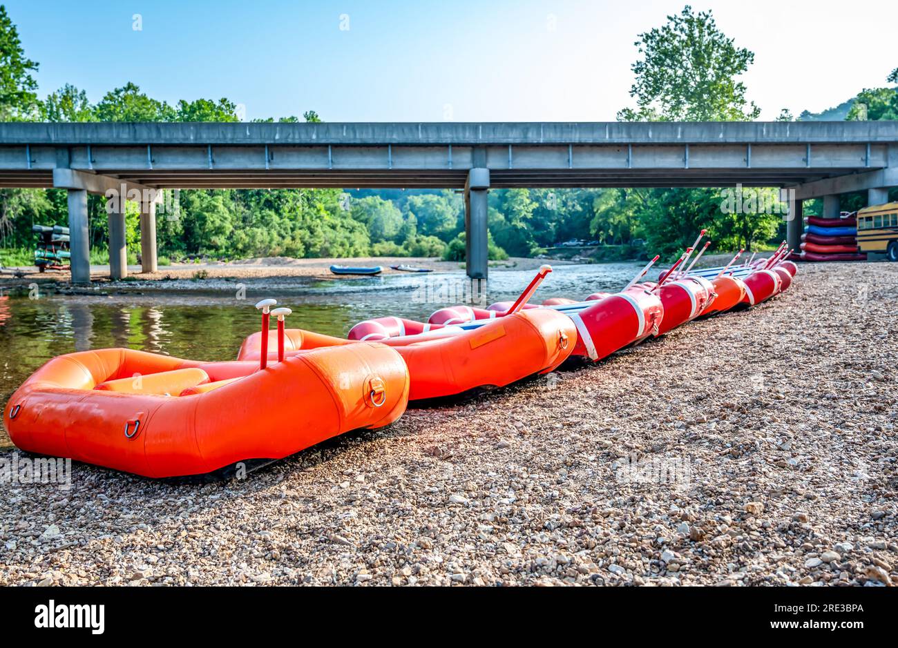 Row of inflatable rafts at the beginning of a float trip on a river ...