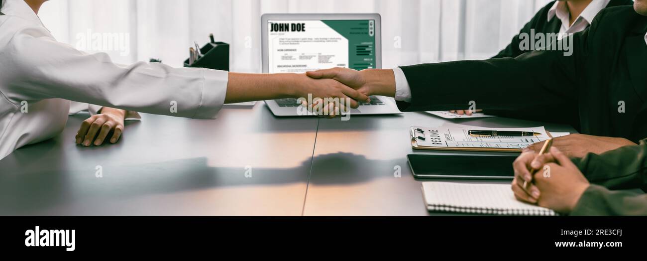 Interviewer handshaking the applicant hi-res stock photography and ...