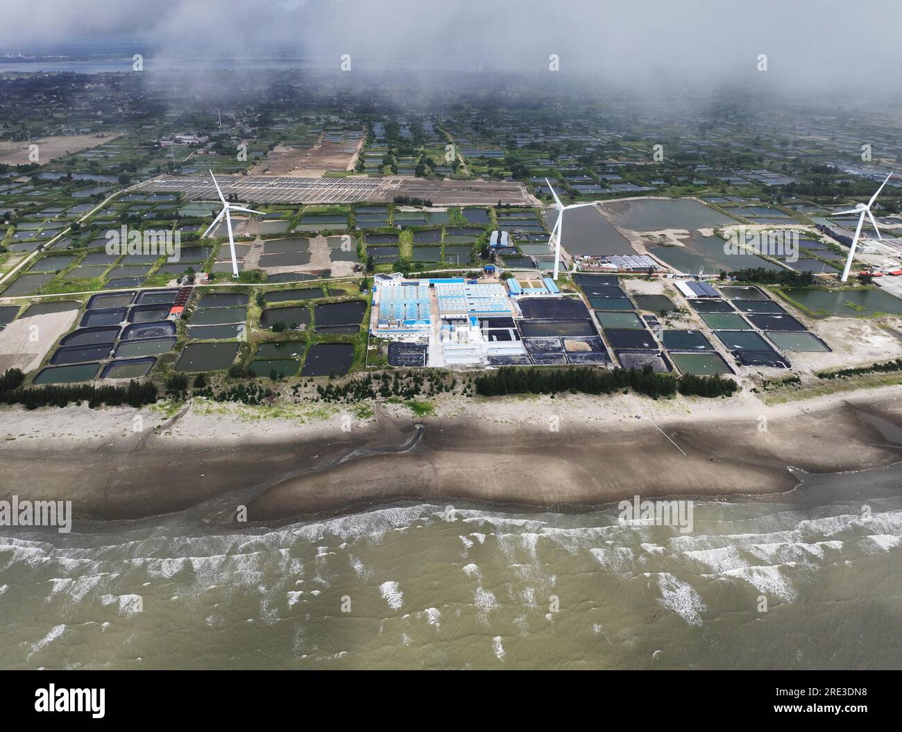 Aerial photo shows the wind power farm project under construction in Xinliao Township, Xuwen ...