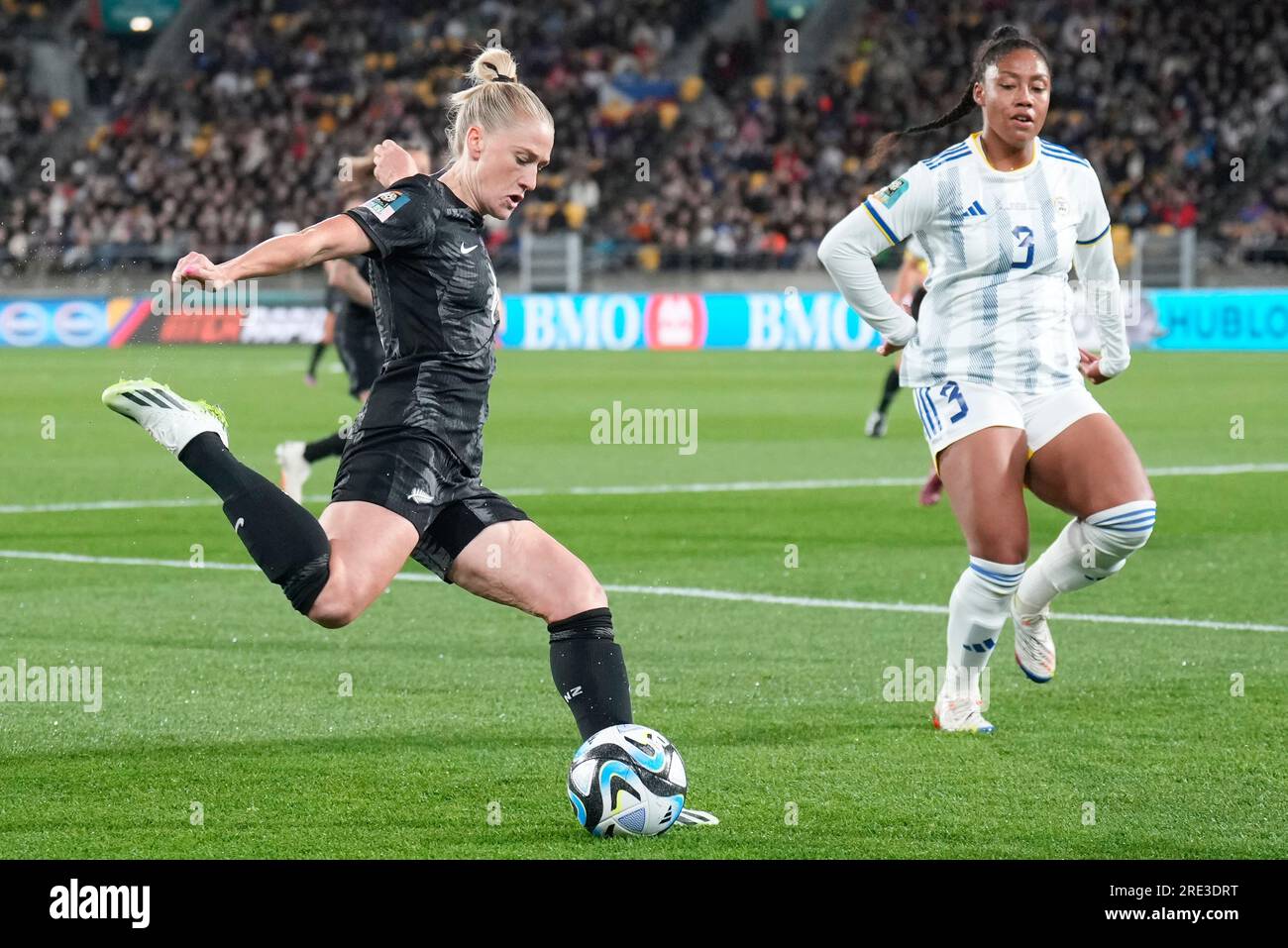 New Zealand's C.J. Bott kicks the ball past Philippines' Jessika Cowart ...