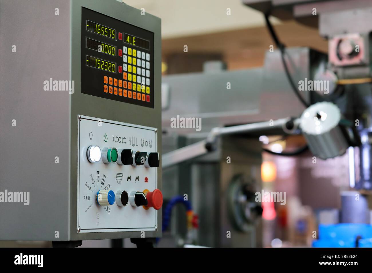 Control panel with digital readout of metalworking machine. Selective ...