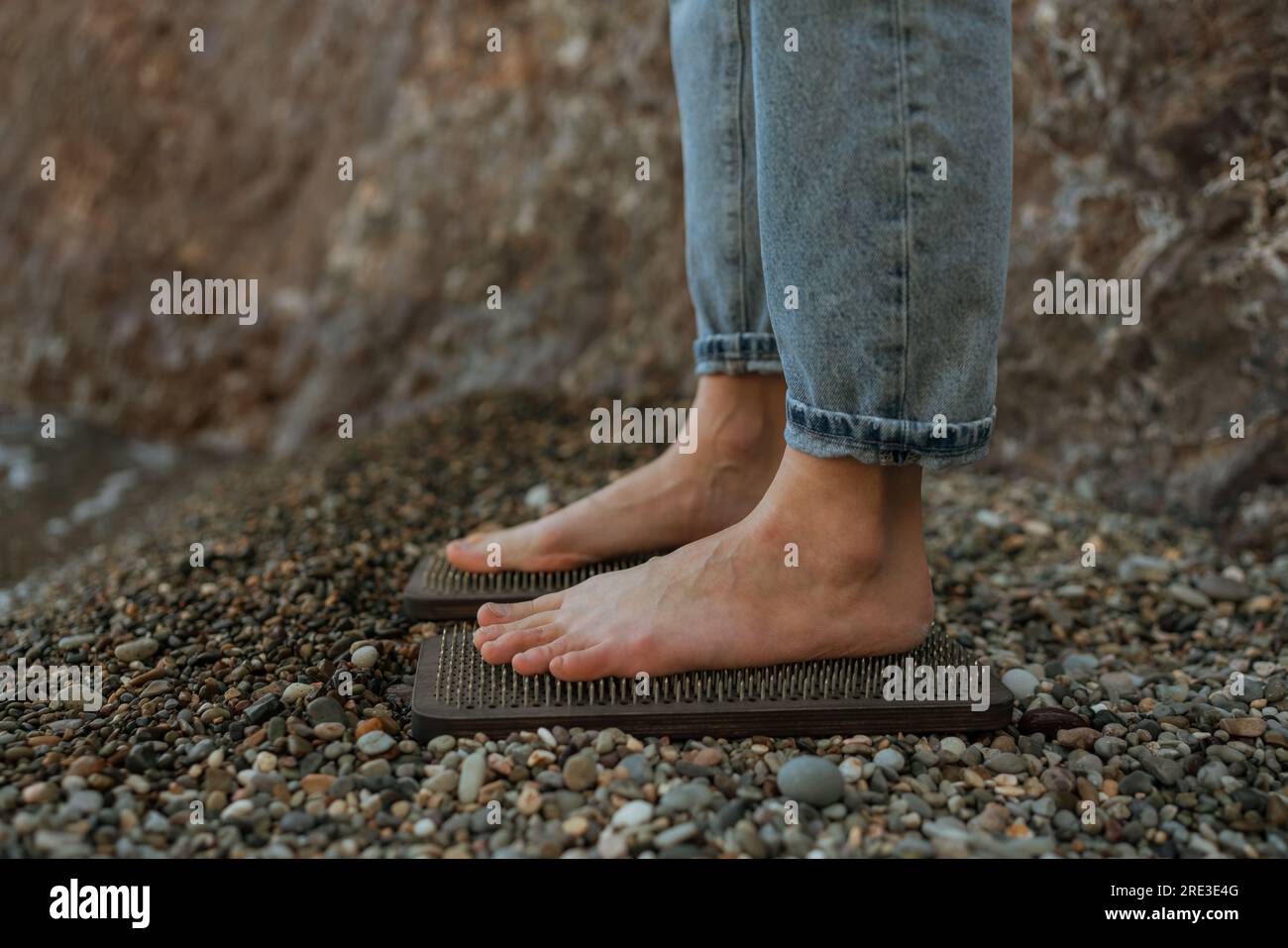 Sea Woman feet stepping on sadhu board during indian practice on the ...