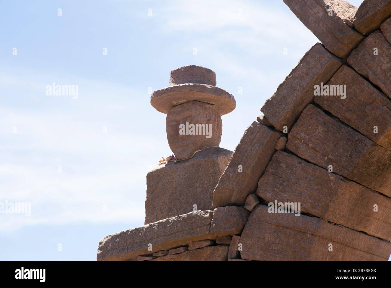 Stone heads carved into the arches on the island of Taquile on Lake ...