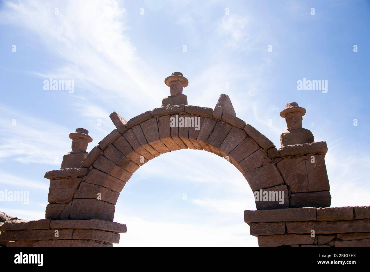 Stone heads carved into the arches on the island of Taquile on Lake ...