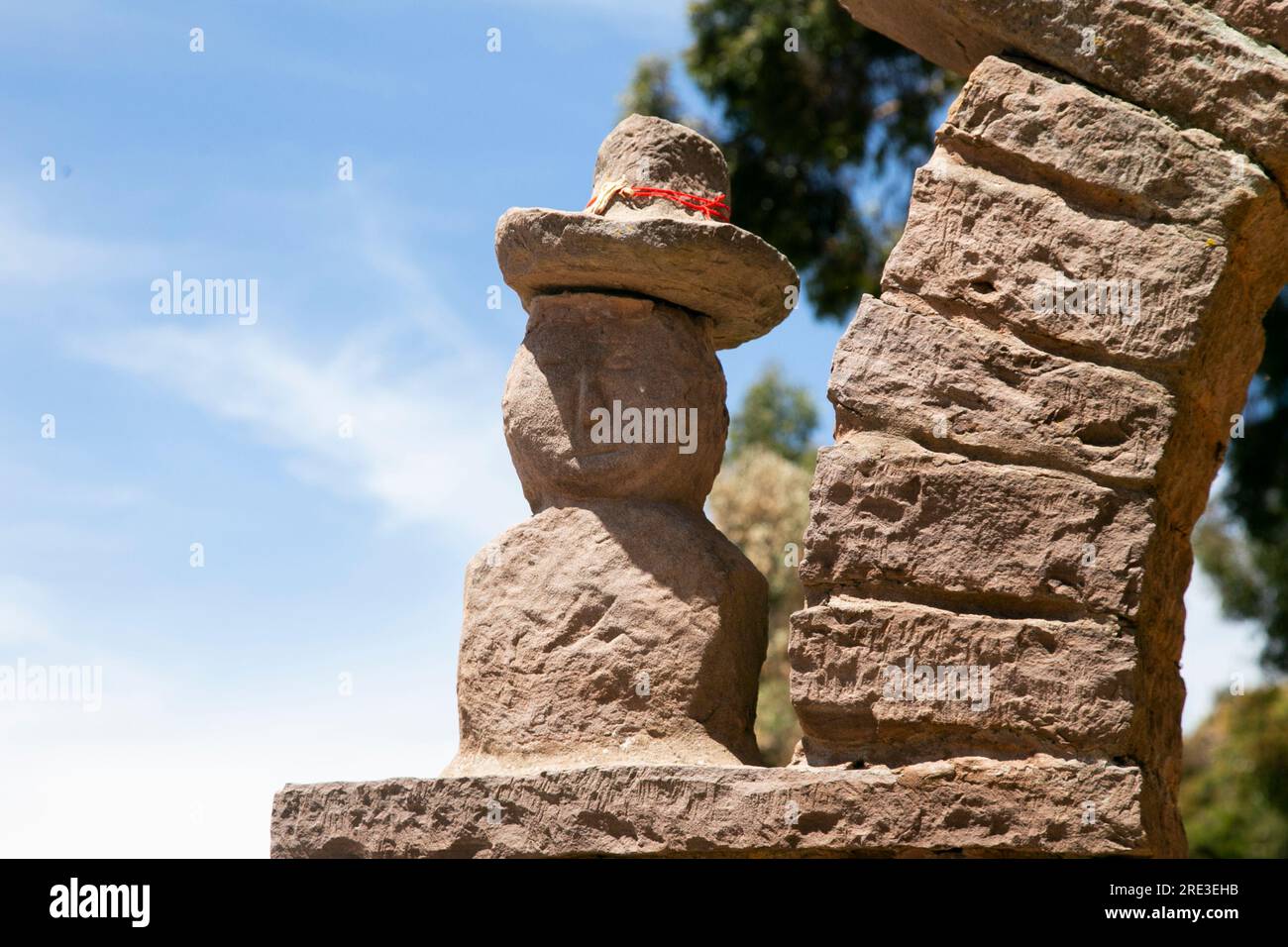Stone heads carved into the arches on the island of Taquile on Lake ...