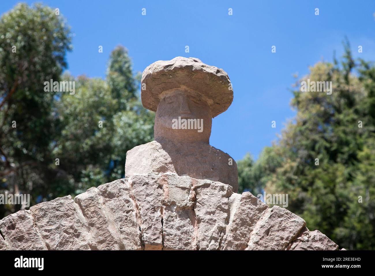Stone heads carved into the arches on the island of Taquile on Lake ...