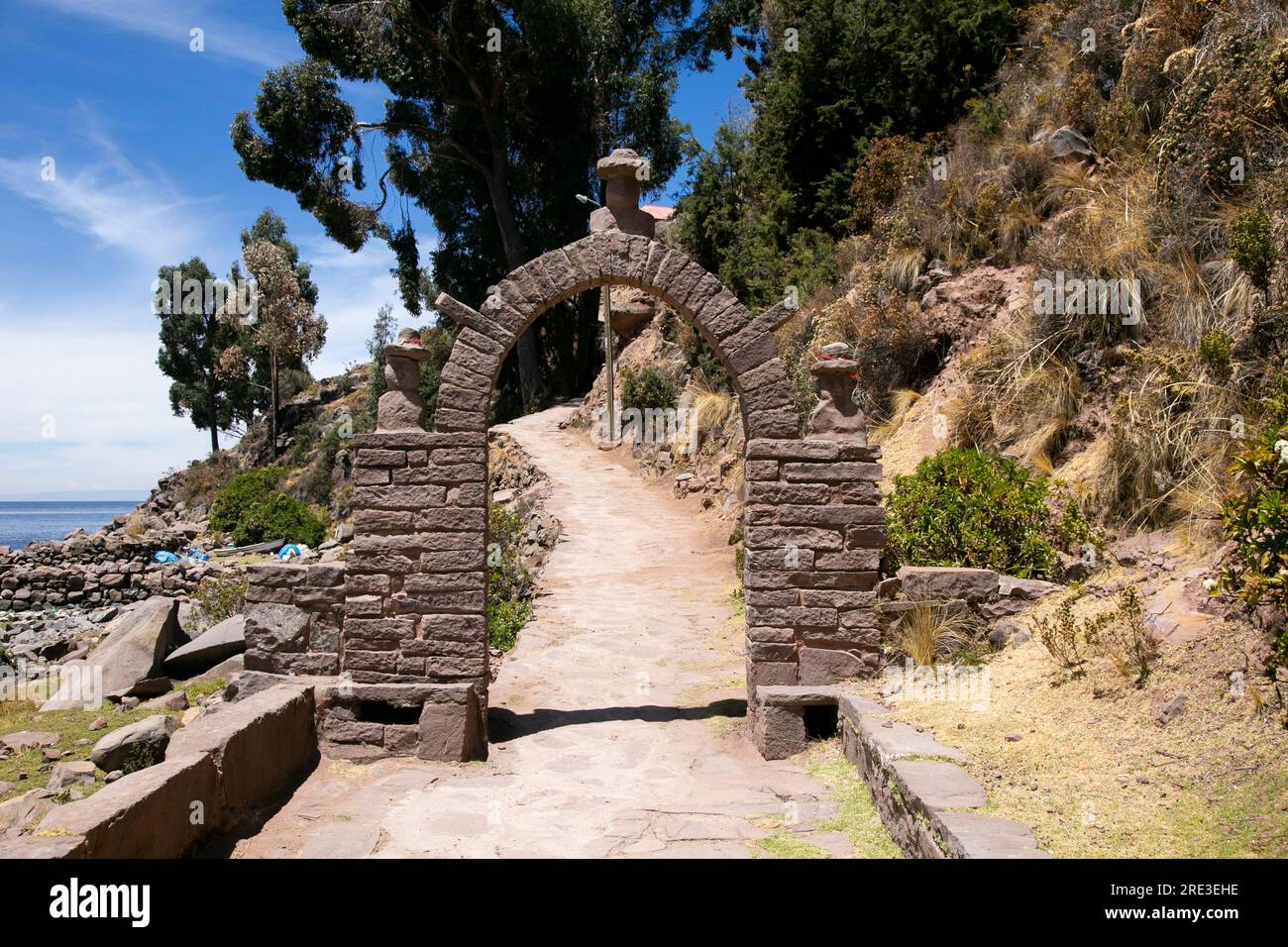 Stone heads carved into the arches on the island of Taquile on Lake ...