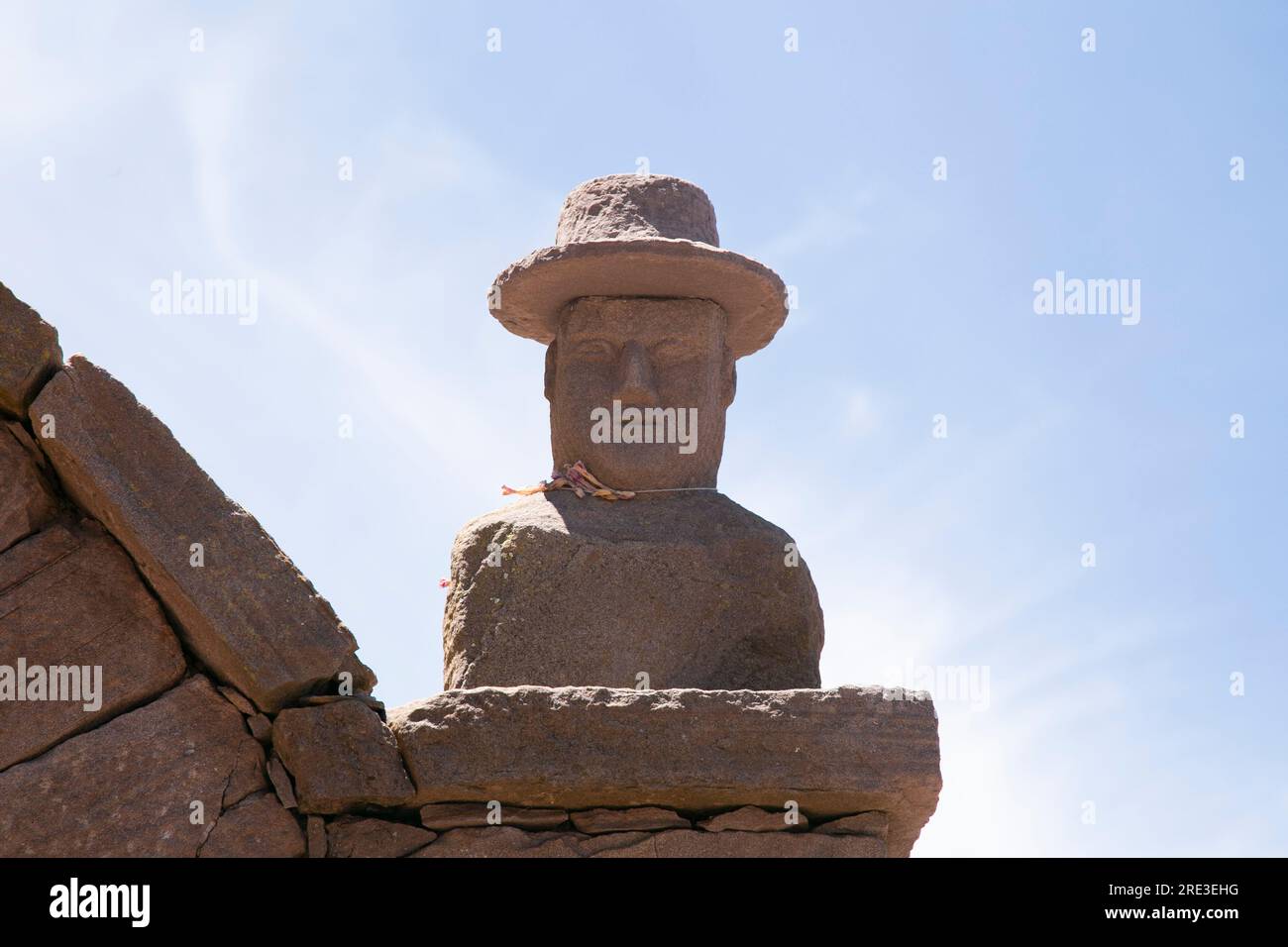 Stone heads carved into the arches on the island of Taquile on Lake ...