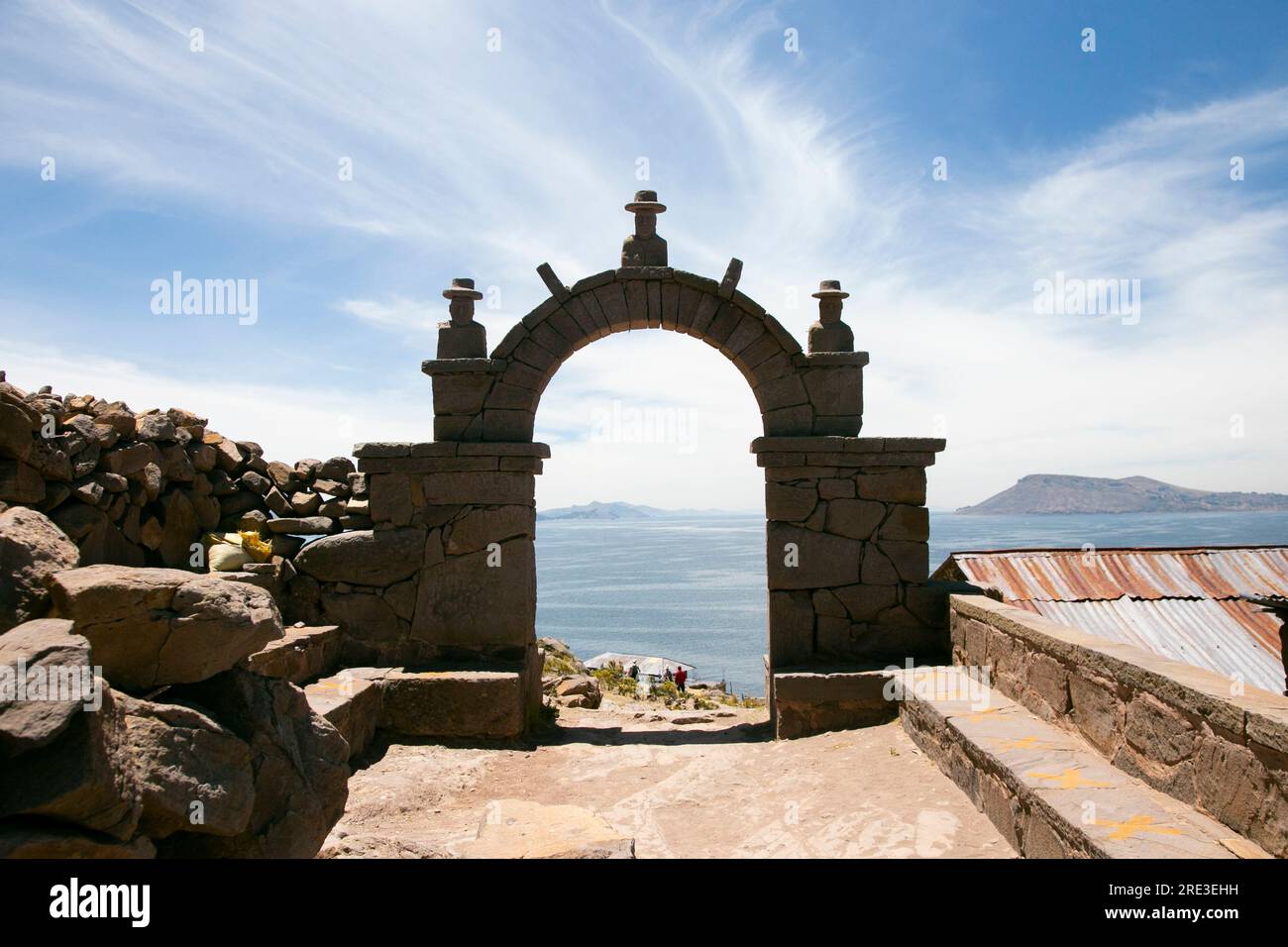 Stone heads carved into the arches on the island of Taquile on Lake ...