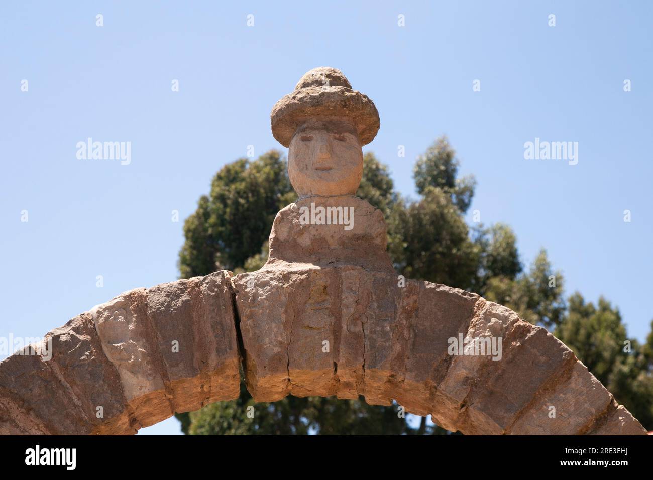 Stone heads carved into the arches on the island of Taquile on Lake ...