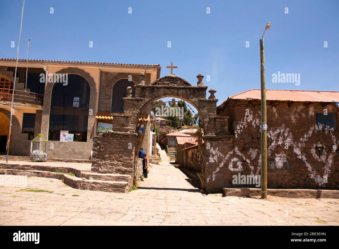 Stone heads carved into the arches on the island of Taquile on Lake ...