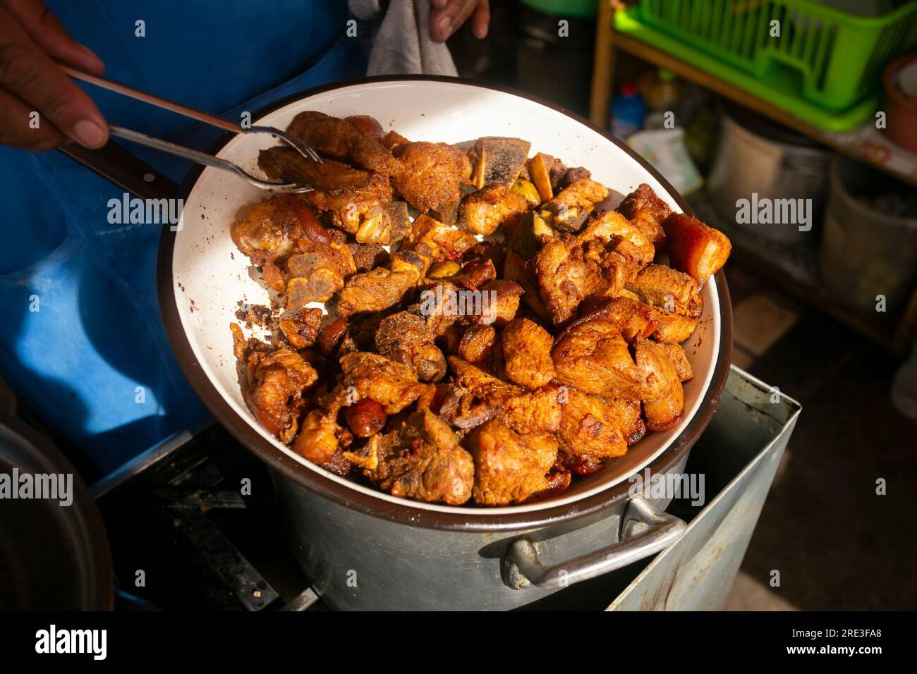 Pork chicharrón is a traditional food in Peru. Pork fat is used to cook ...