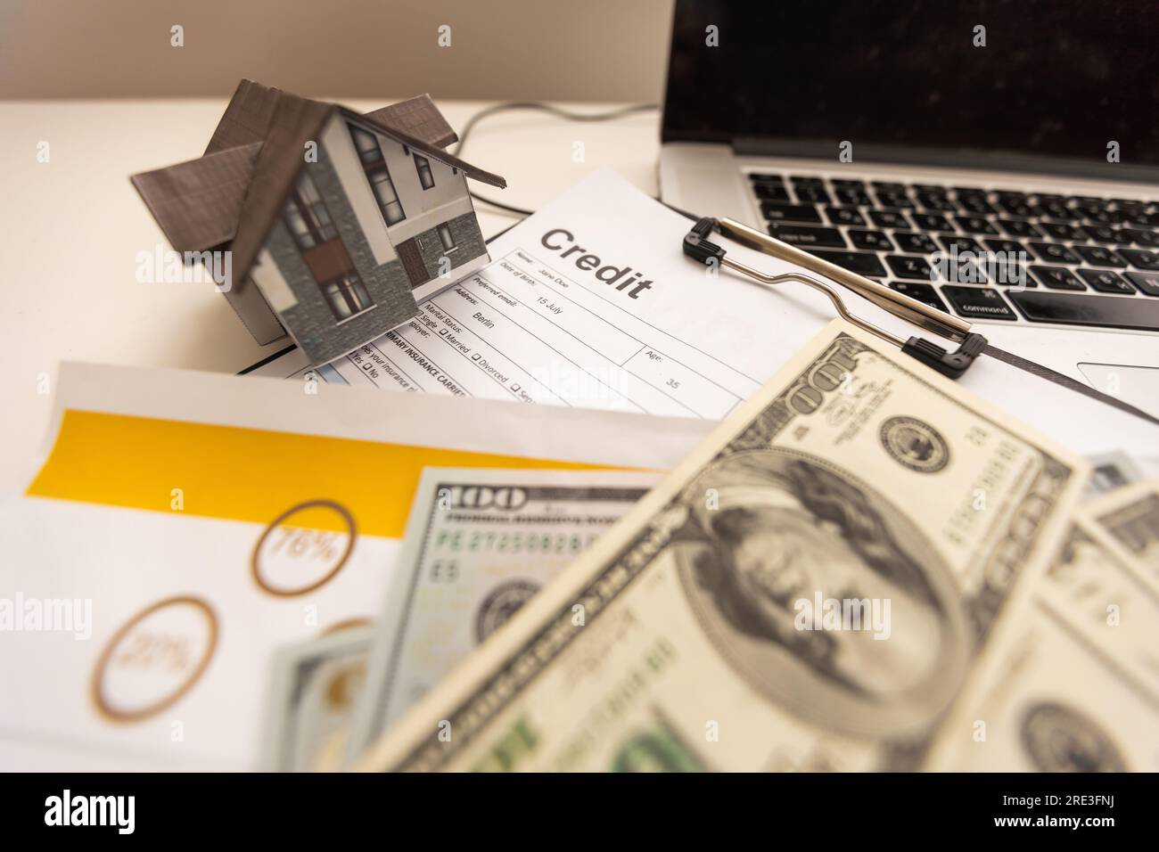 House model put on bank note and loan agreement document. Real estate ...