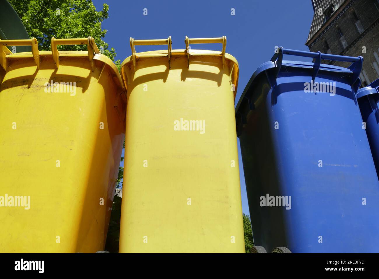 Blue garbage can for waste paper and yellow garbage can for plastic ...