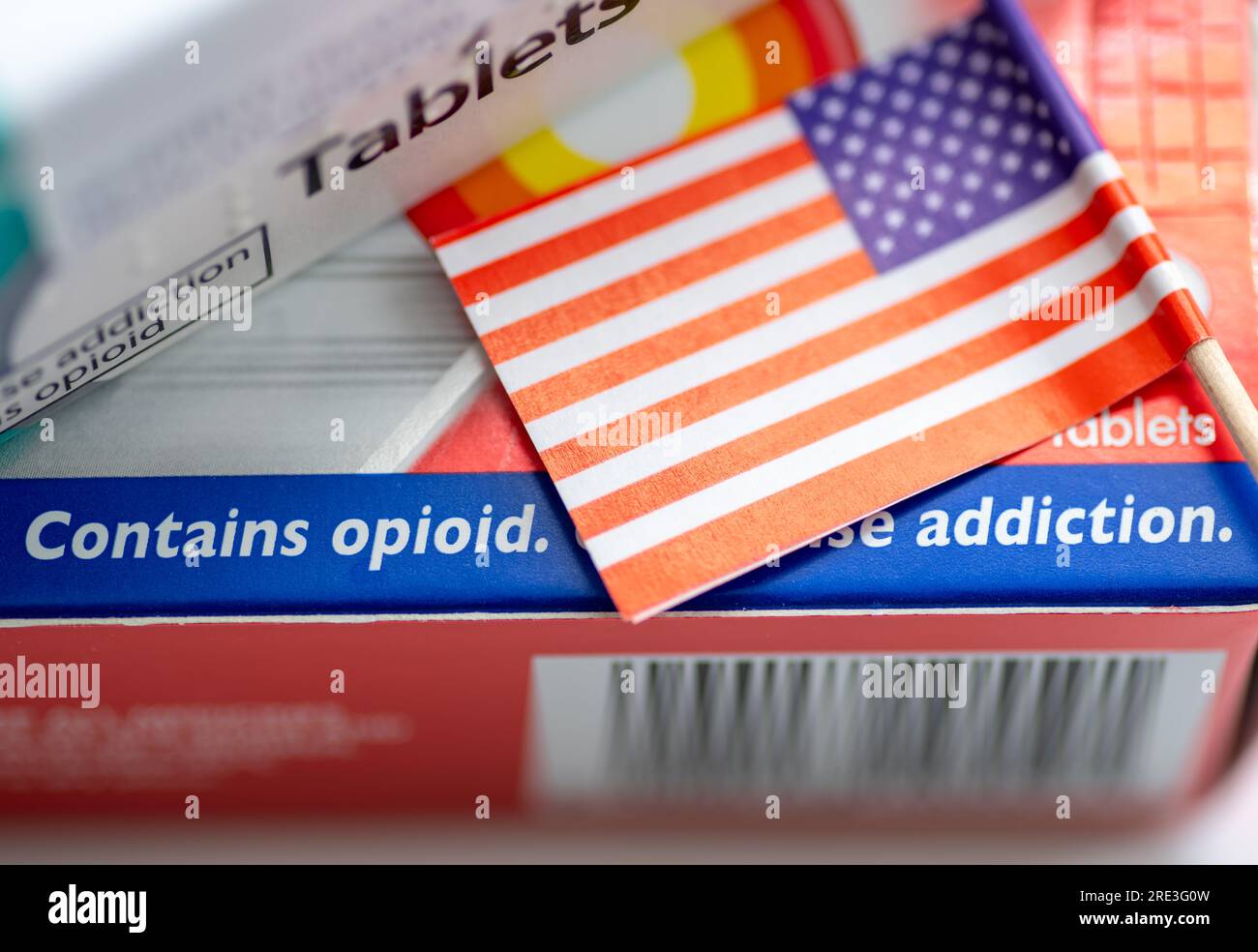 A drugs addiction concept with the American flag and boxes of medicine ...