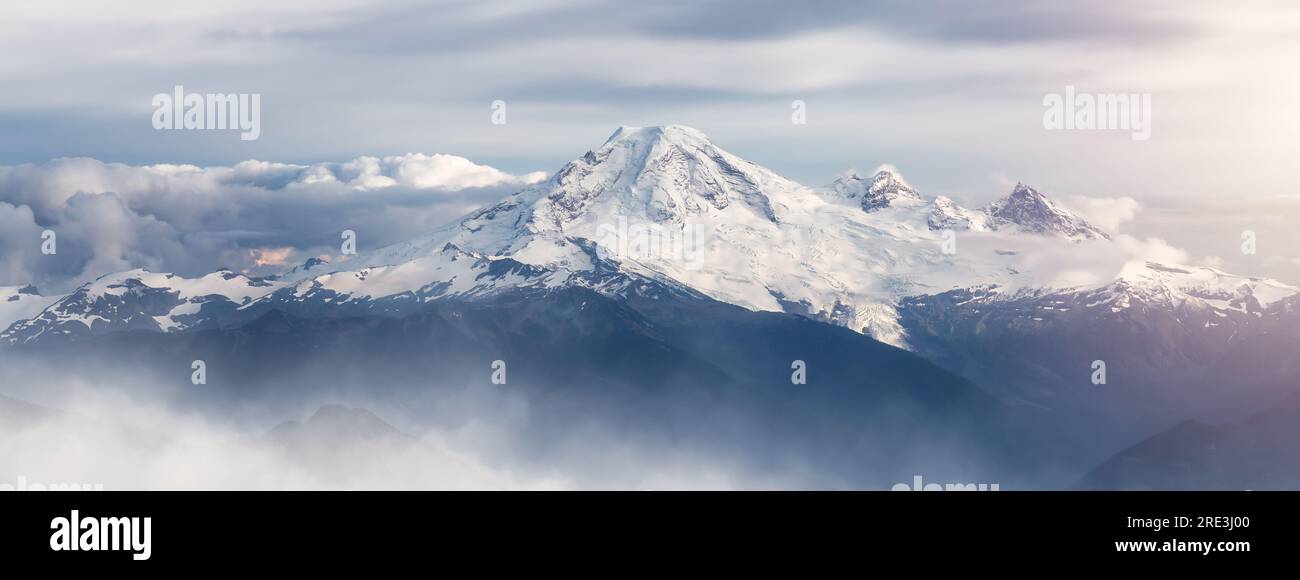 Mt Baker covered in snow and clouds. Aerial landscape nature background ...