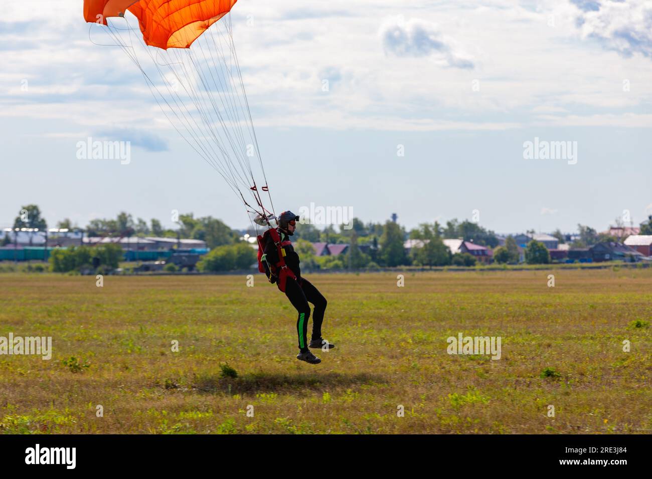 Parachute in the sky. Skydiver is flying a parachute in the blue sky ...