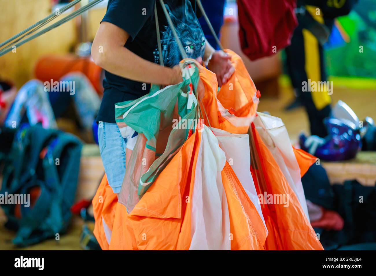 Packing a parachute into a backpack. High quality photo Stock Photo - Alamy