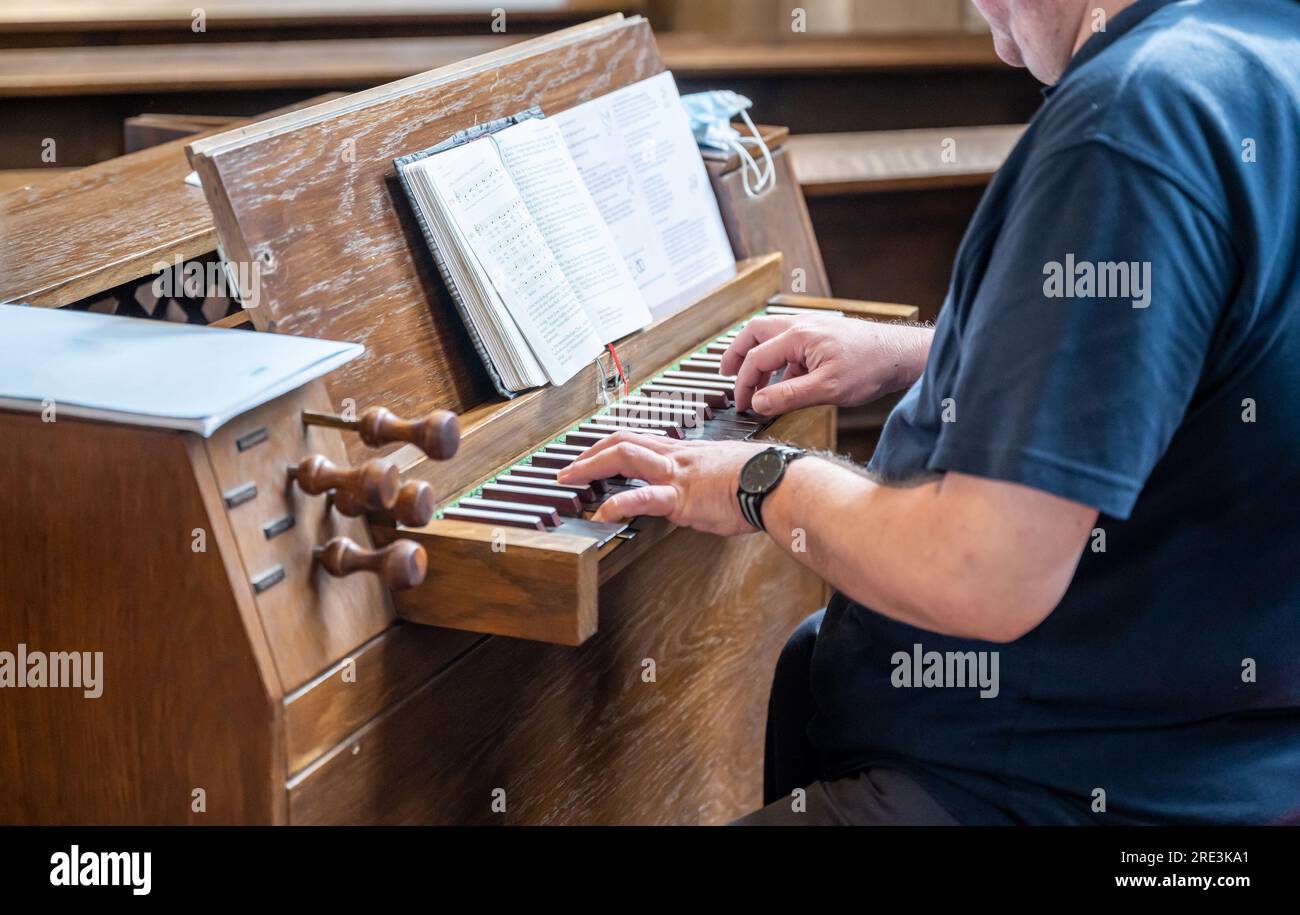 Hand playing on church organ at Event dinner Close-up Small depth of ...