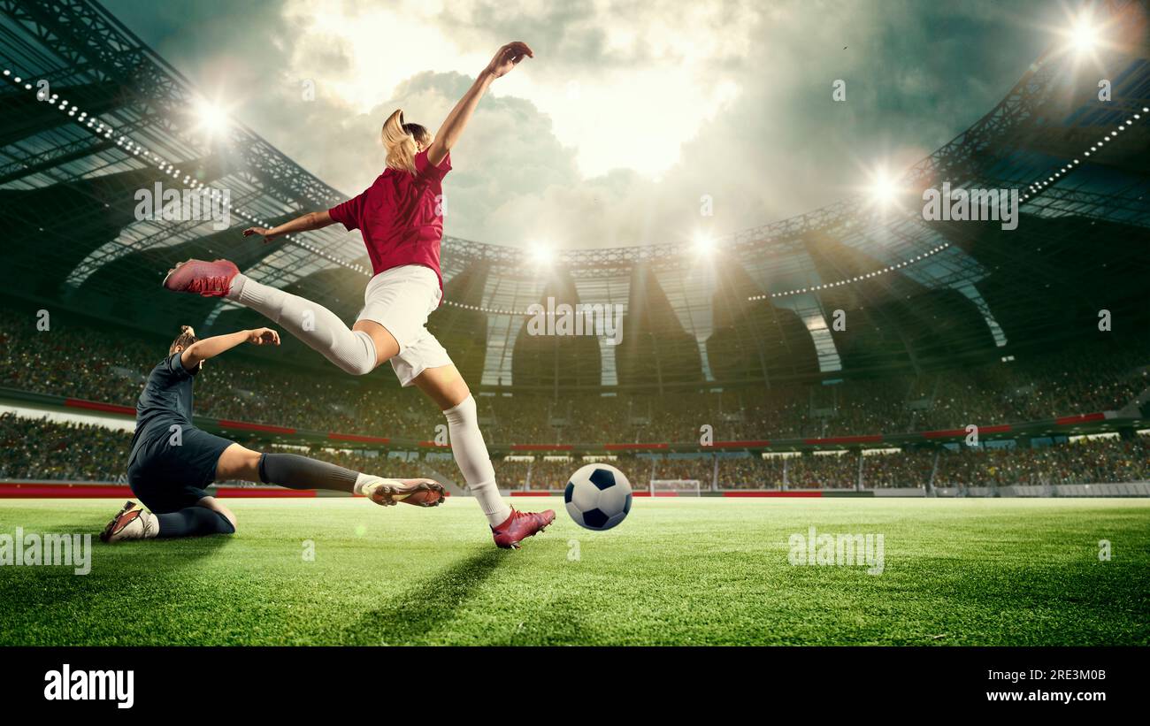 Motivated young women, football, soccer players during match, game ...