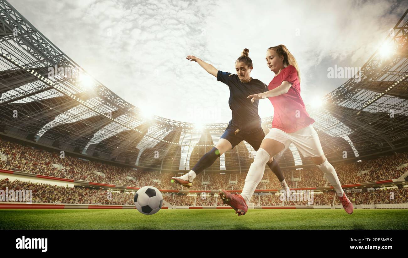 Two women, professional football, soccer players in motion during match ...