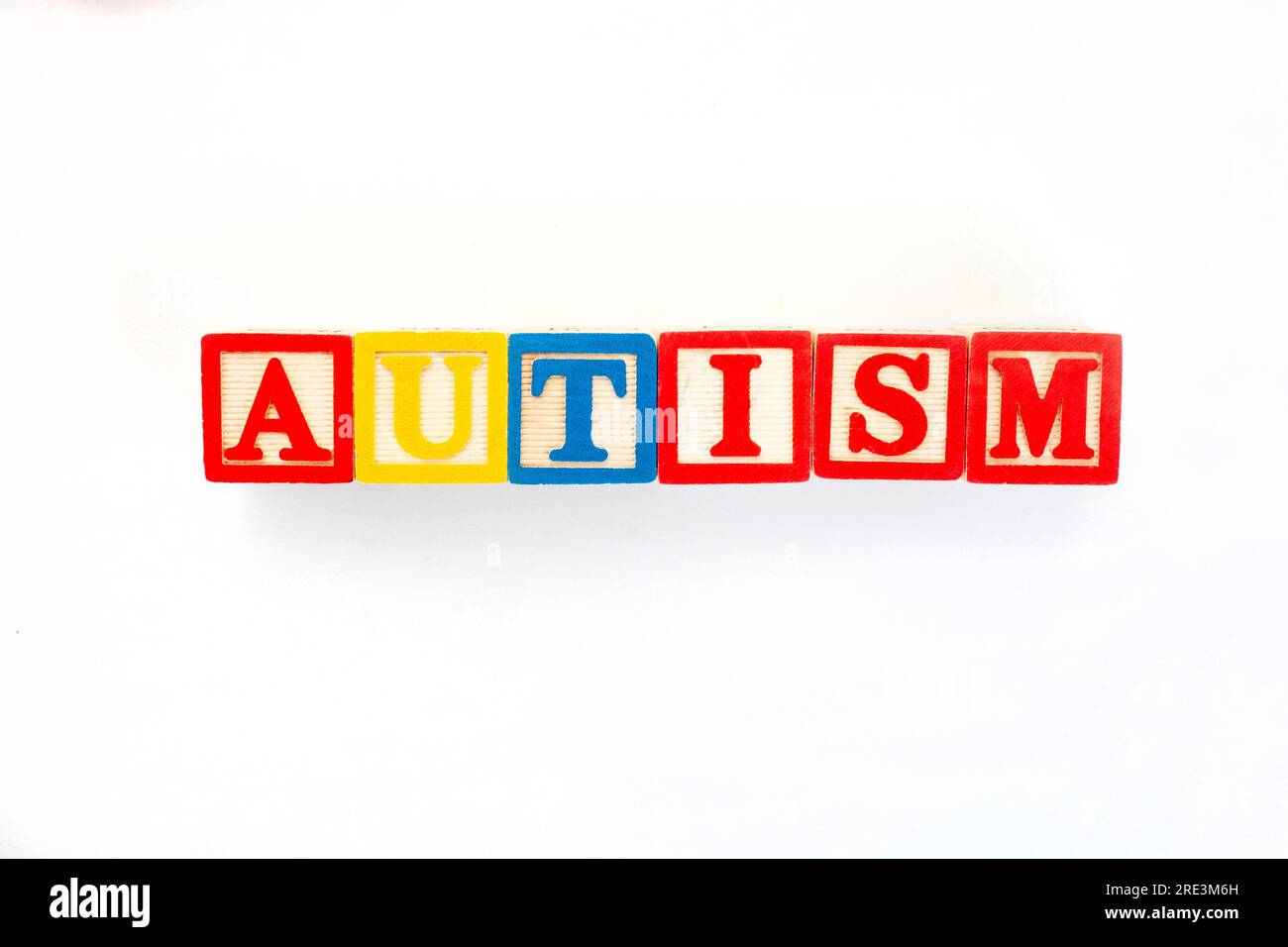 Autism spelled out in kids building blocks on plain white background ...