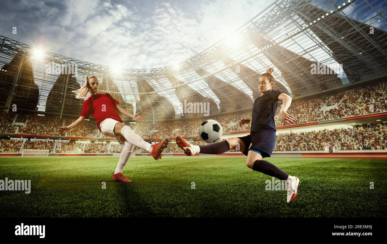 Concentrated young women, soccer, football players in motion, during ...