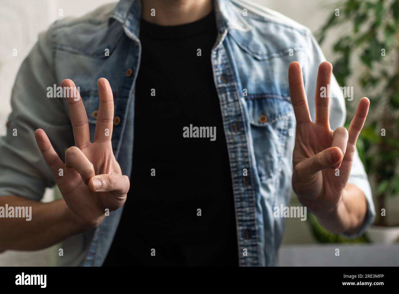 Man showing gesture in sign language on white background Stock Photo ...