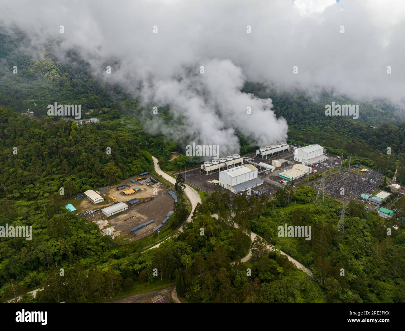 Geothermal station with steam and pipes. Renewable energy production at ...
