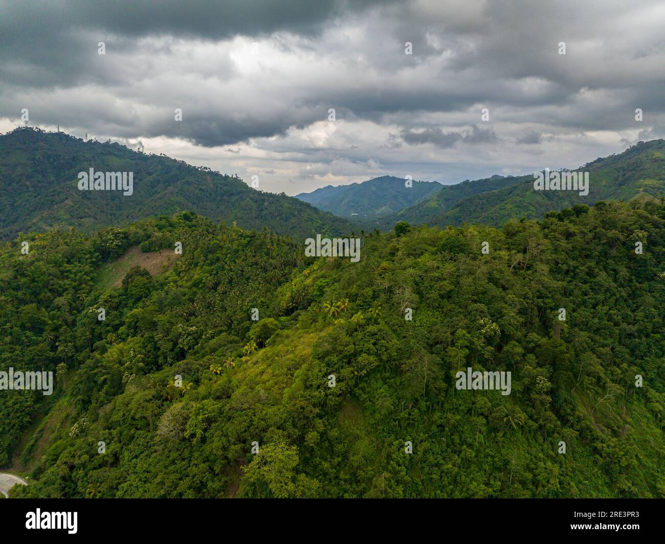 Mountain landscape on tropical island with mountain peaks covered with ...