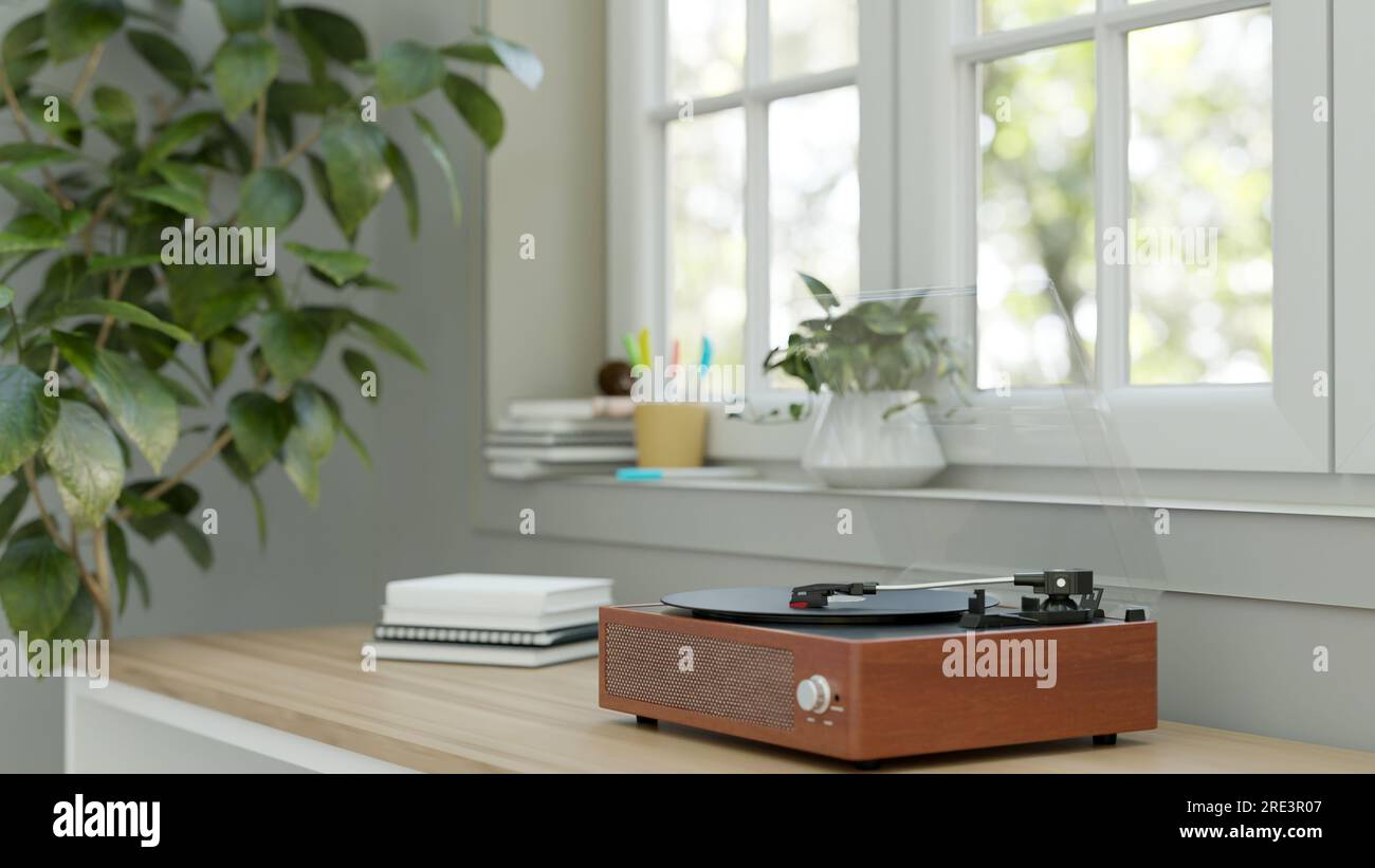 Close-up image of a vintage record player on a wooden table against the ...