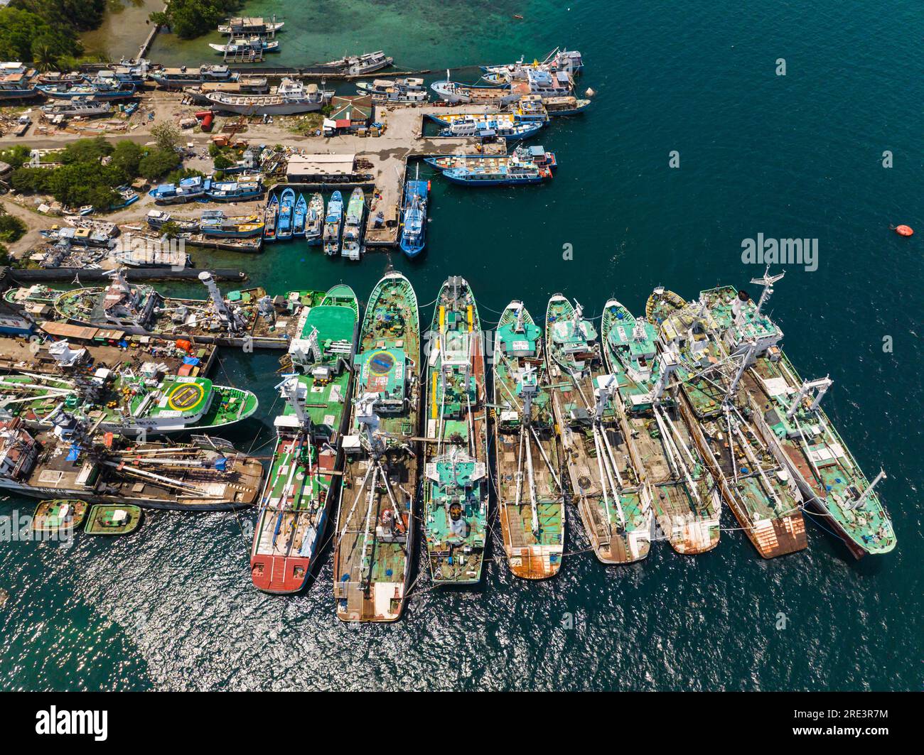 Top down view of fishing vessels with sunlight reflection over the sea ...