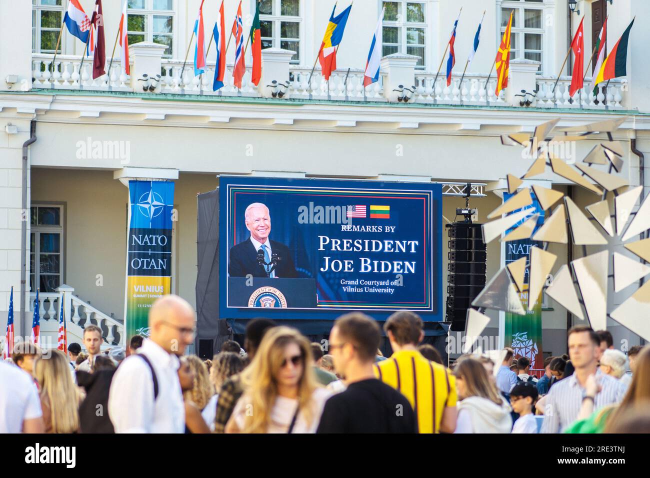 US President Joe Biden smiling in an advertising banner in front of ...