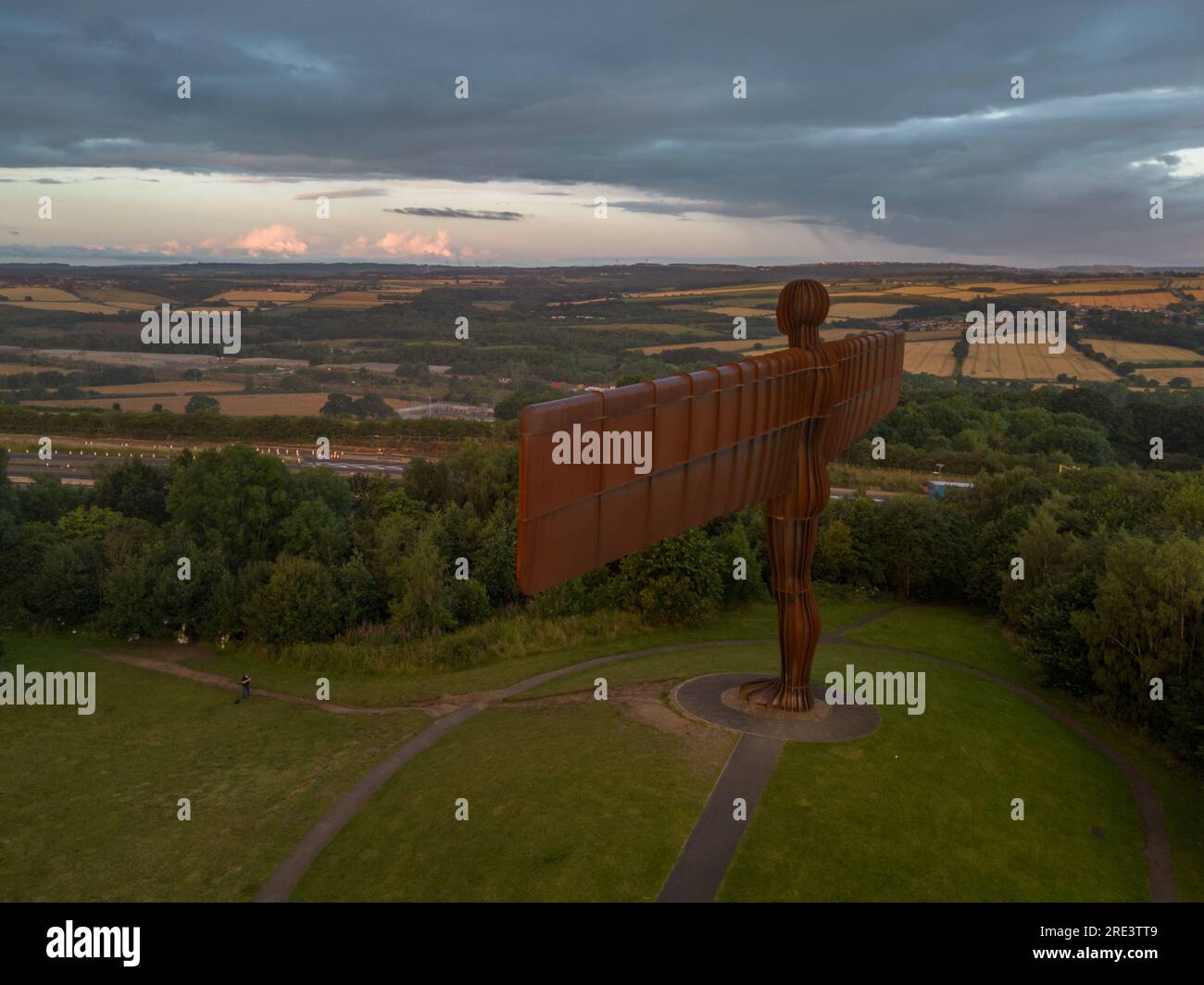 Side drone shot at dawn of Angel of the North with the A1 highway ...